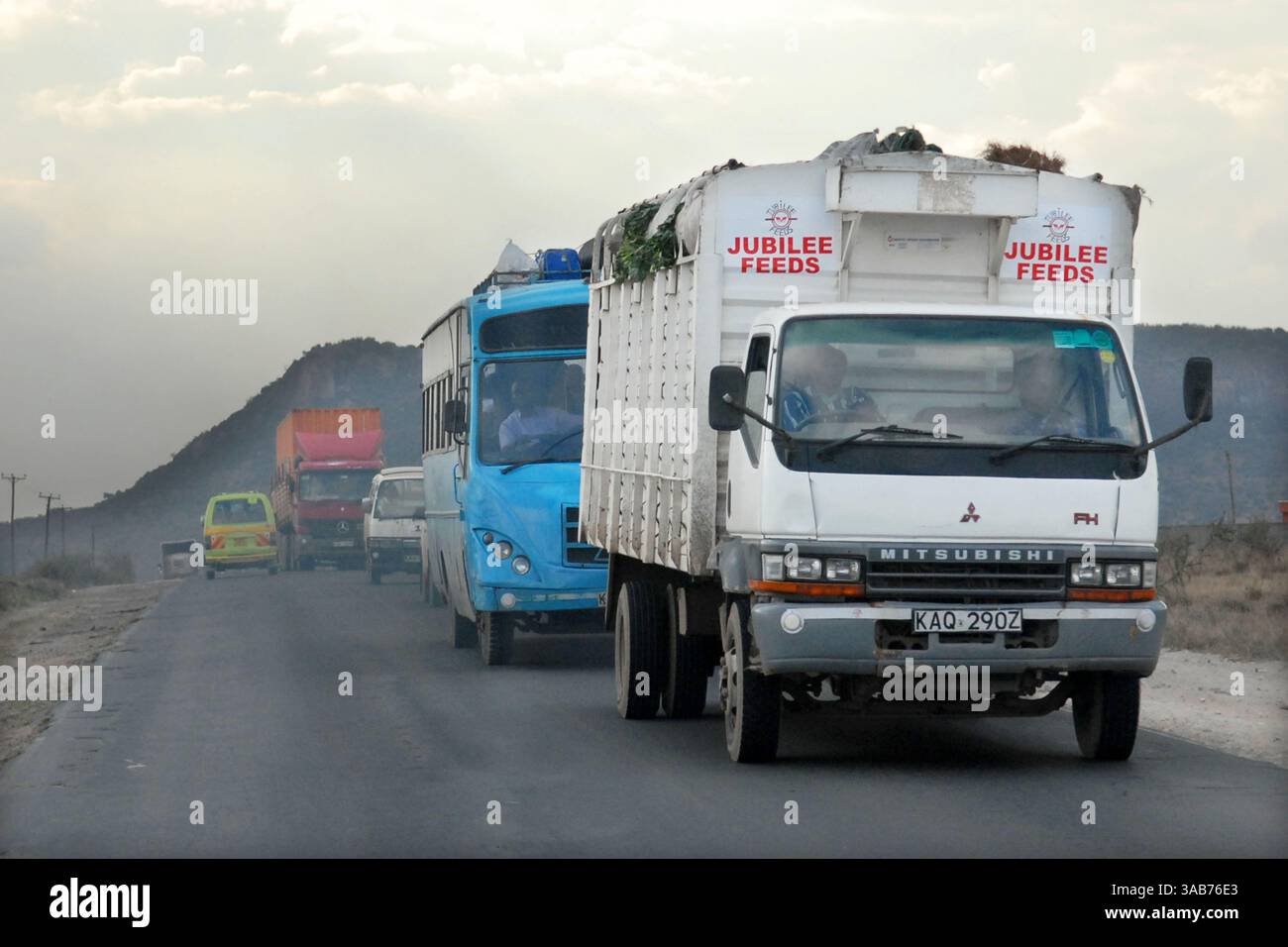 Large and small vehicles fight for road space on the dangerous mud ...