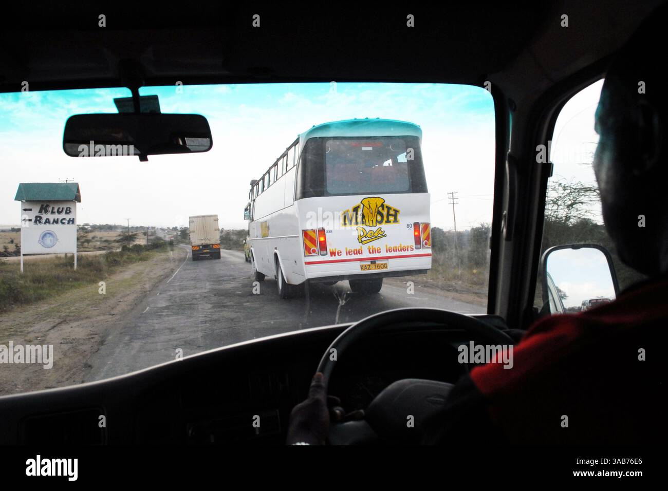 Large and small vehicles fight for road space on the dangerous mud ...