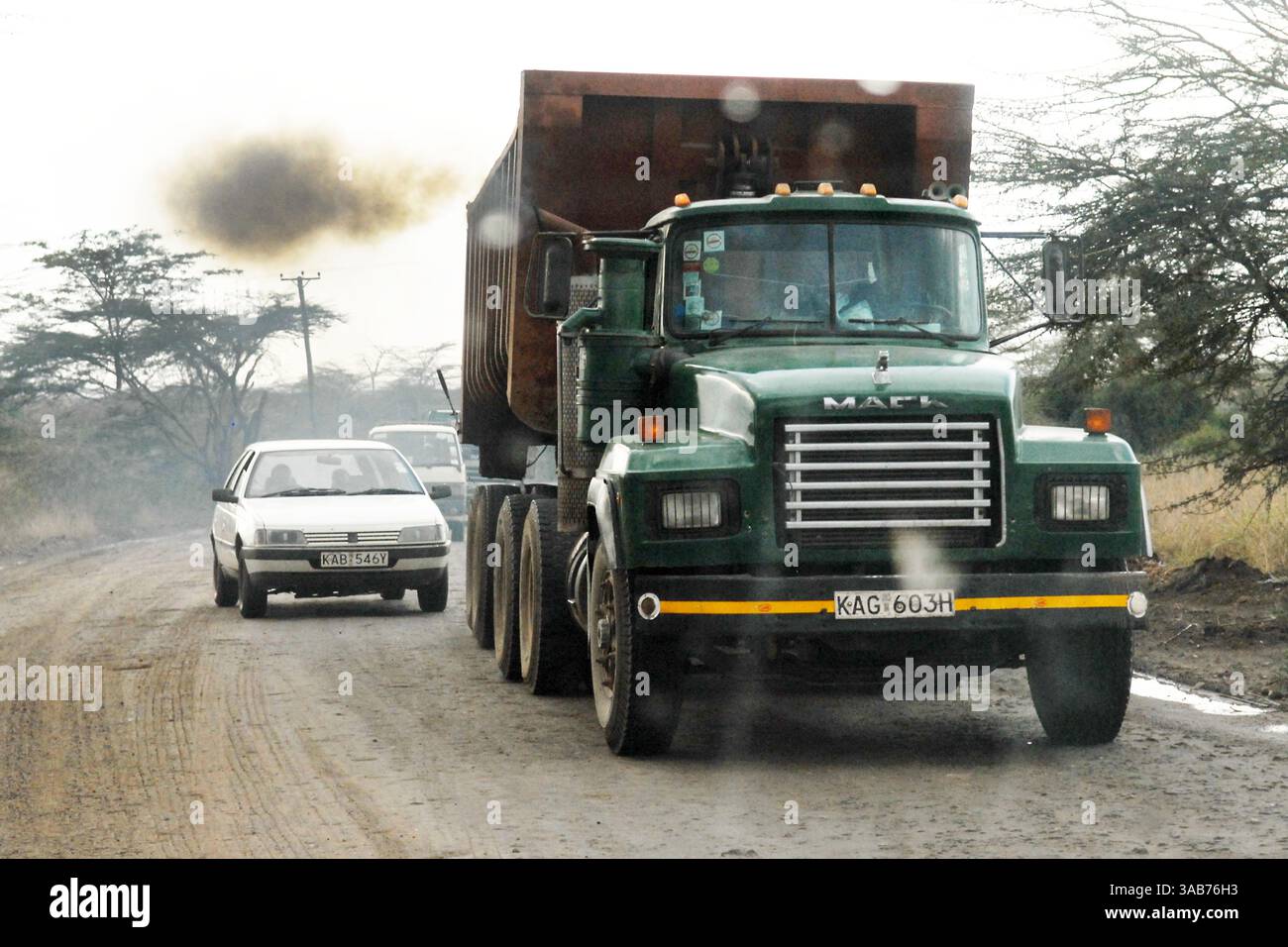 Large and small vehicles fight for road space on the dangerous mud ...