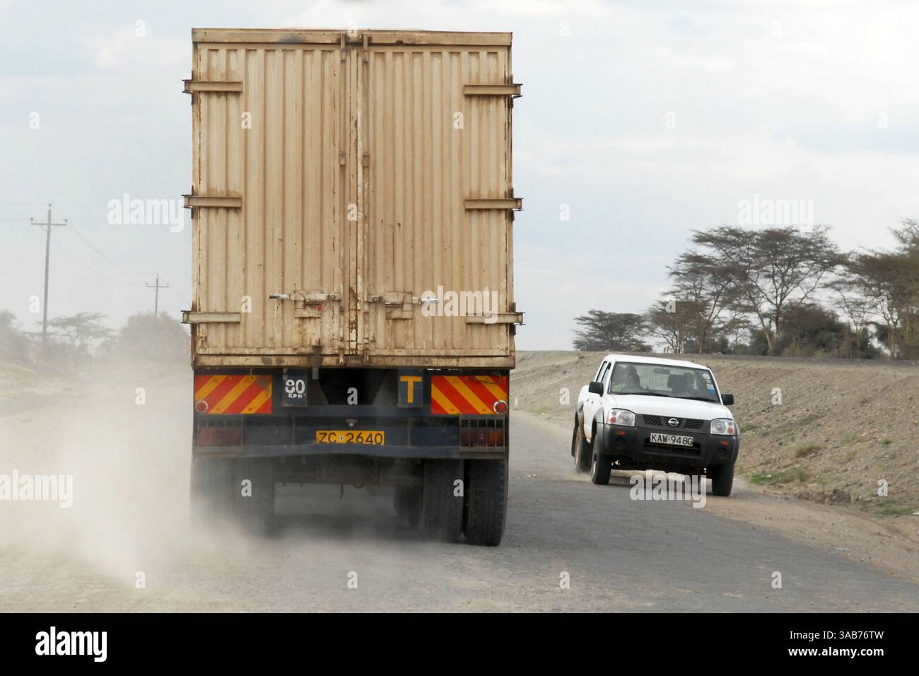 Large and small vehicles fight for road space on the dangerous mud ...