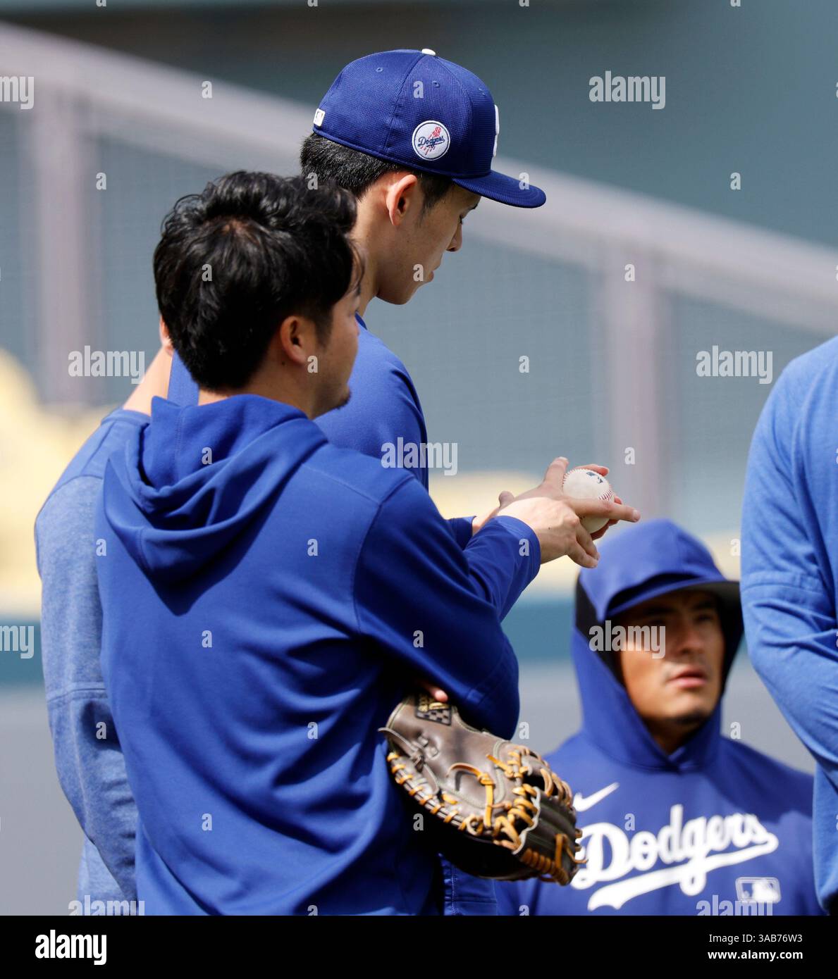 Los Angeles Dodgers' Roki Sasaki shows his split-finger fastball during ...