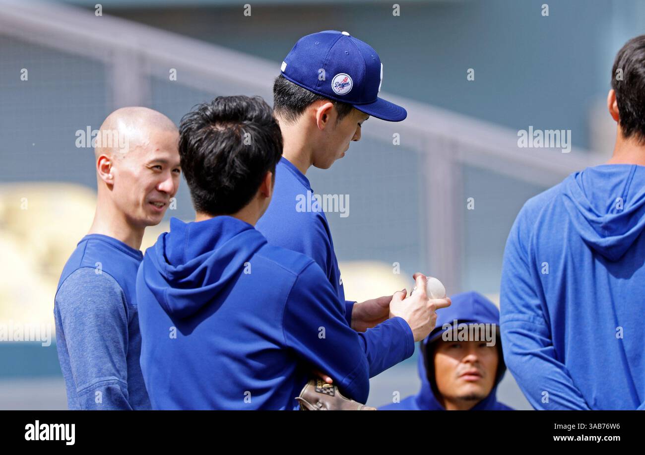 Los Angeles Dodgers' Roki Sasaki shows his split-finger fastball during ...