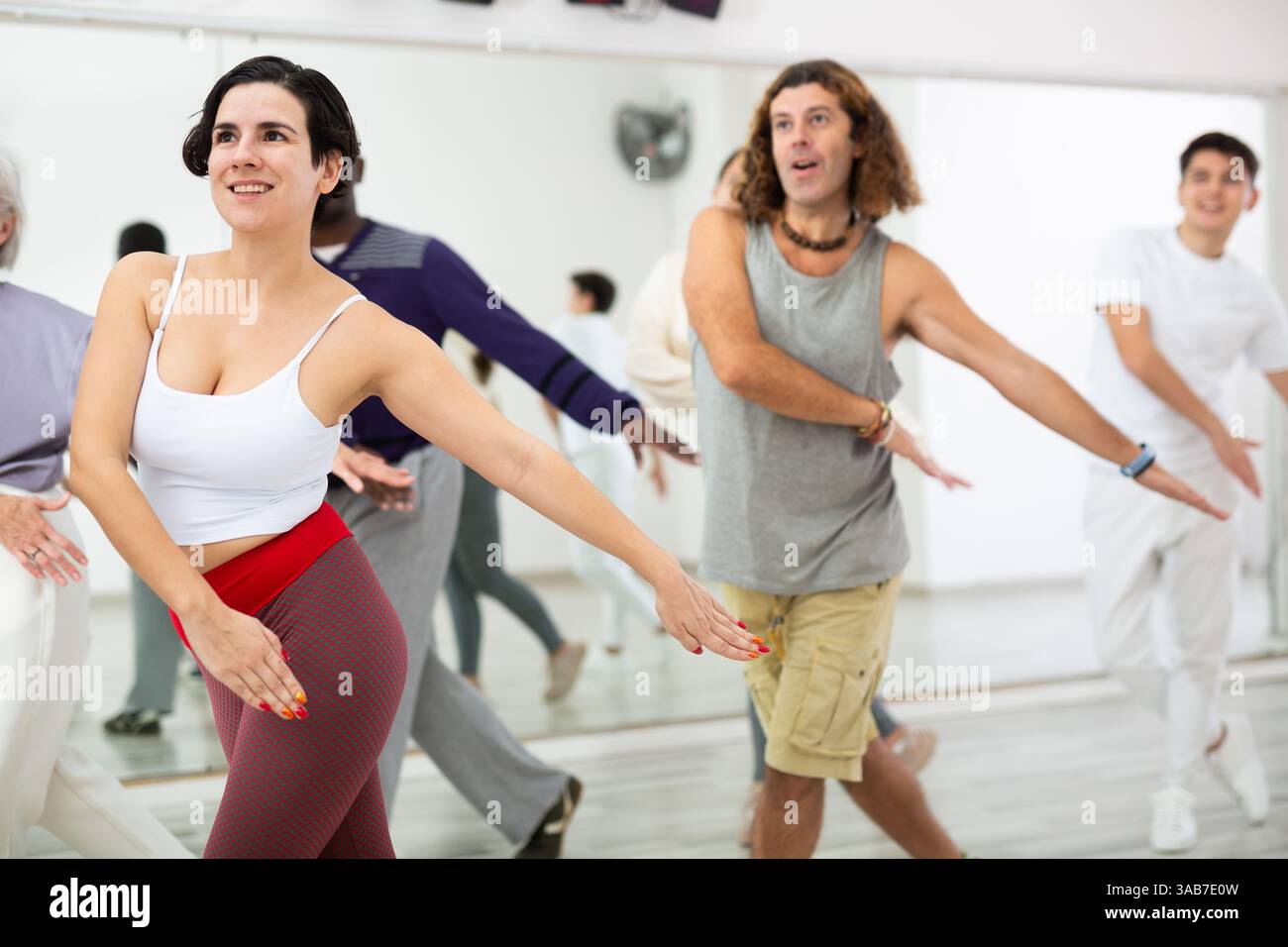 Group of adult people practices dance aerobics Stock Photo - Alamy