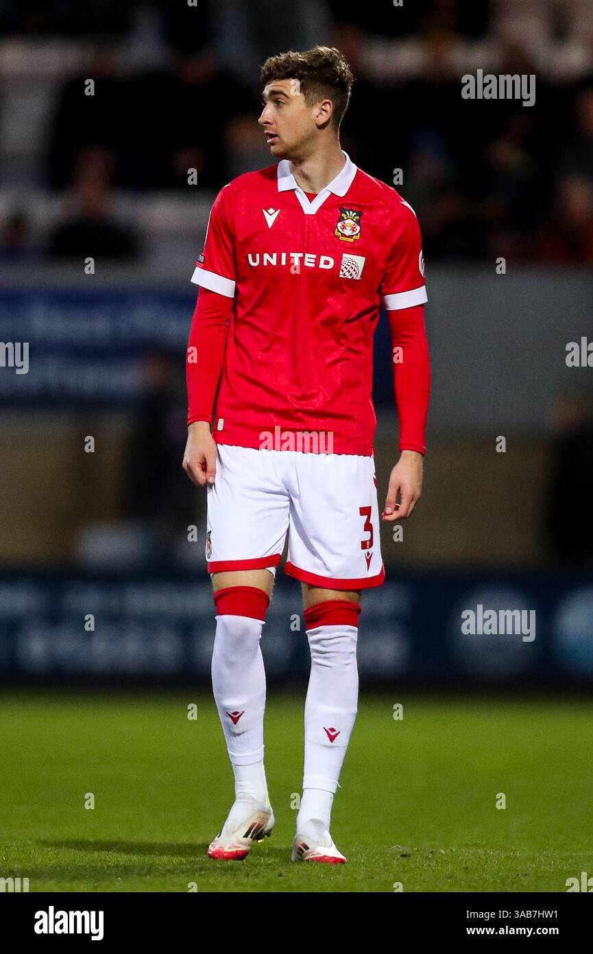 Cambridge, UK. 01st Apr, 2025. Lewis Brunt of Wrexham AFC looks on ...
