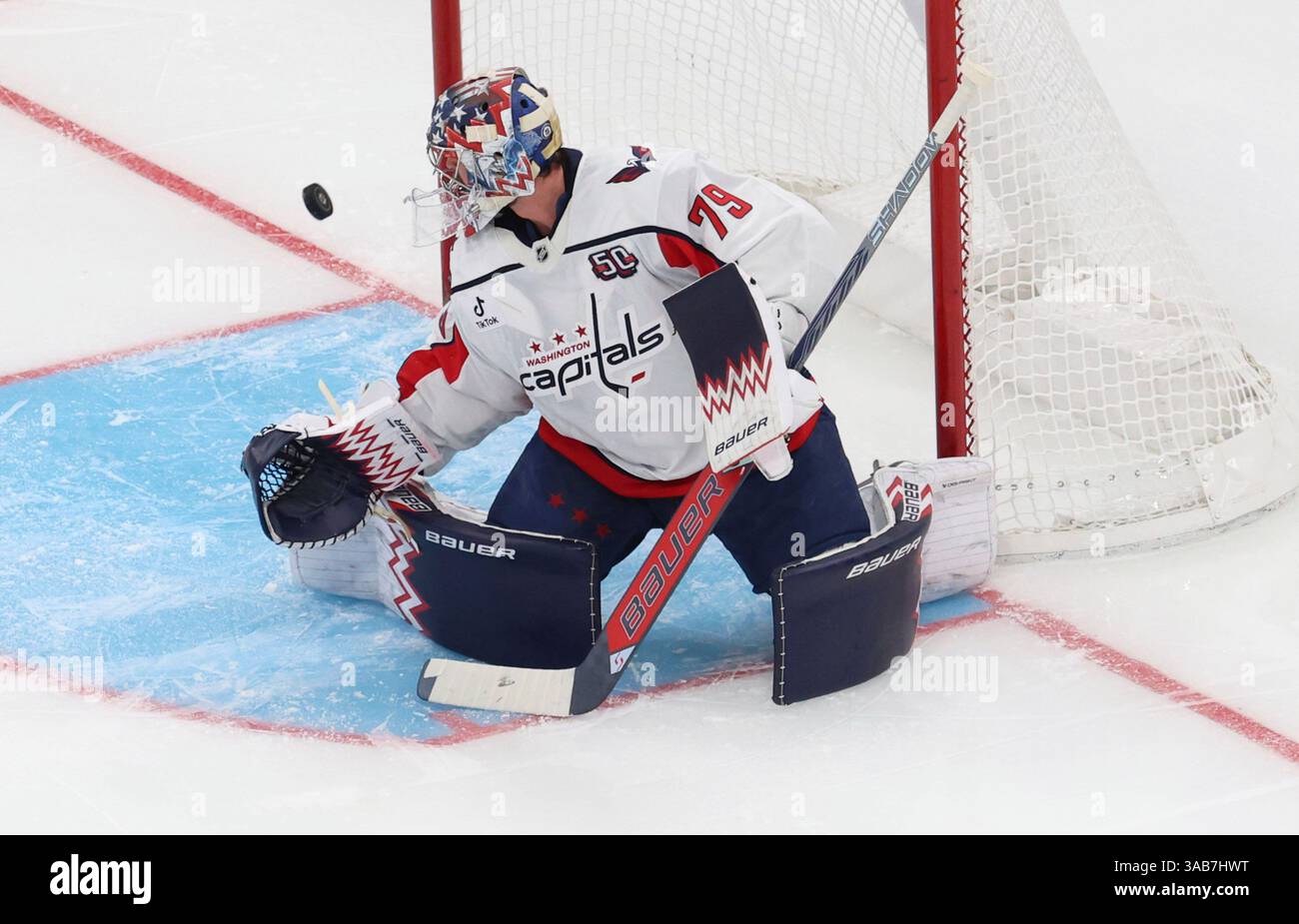 Washington Capitals goaltender Charlie Lindgren (79) deflects the puck ...