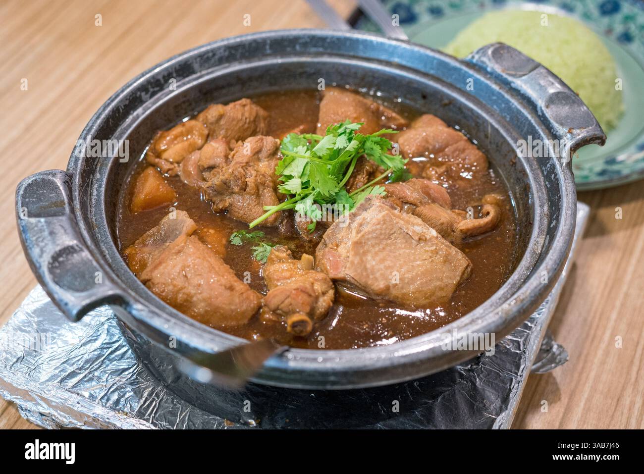 Chicken Pongteh, a traditional peranakan nyonya food. High angle view ...