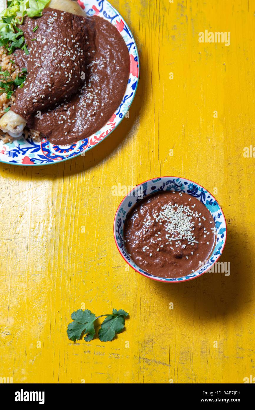 Mexican traditional mole poblano sauce and chicken with rice with mole ...
