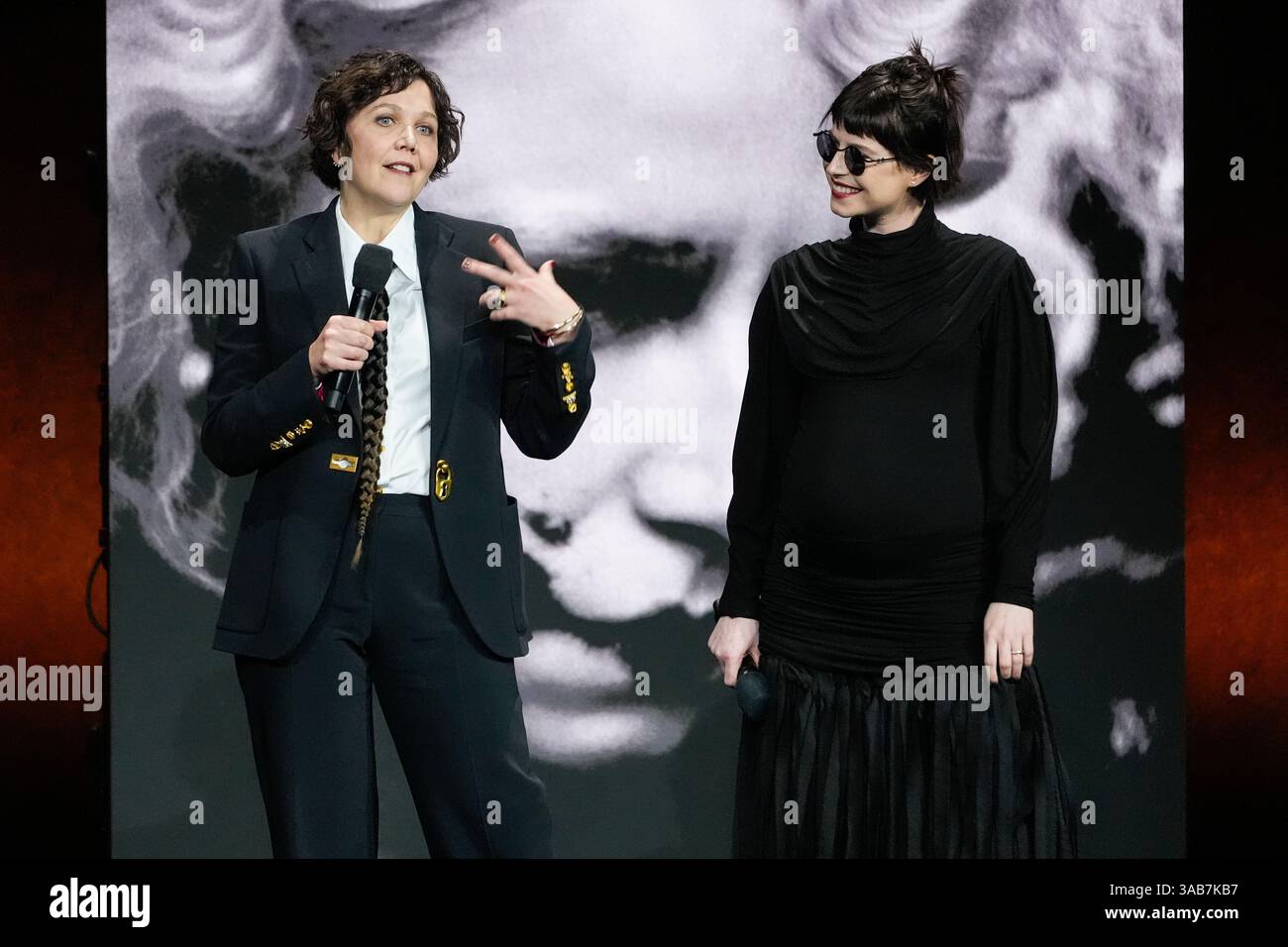 Maggie Gyllenhaal, left, director and producer of the upcoming film ...