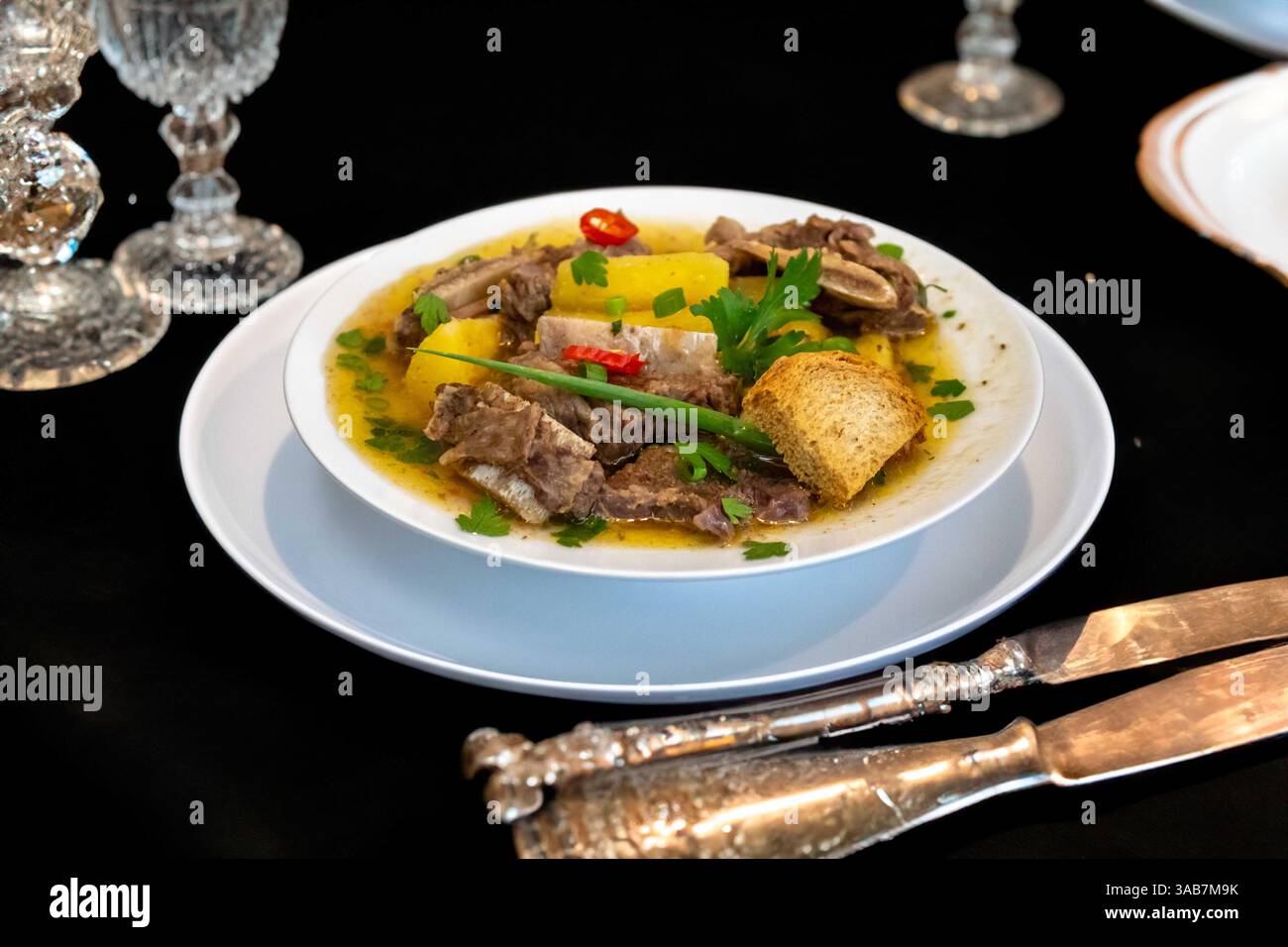 Traditional rustic Brazilian soup known as vaca atolada, prepared with ...