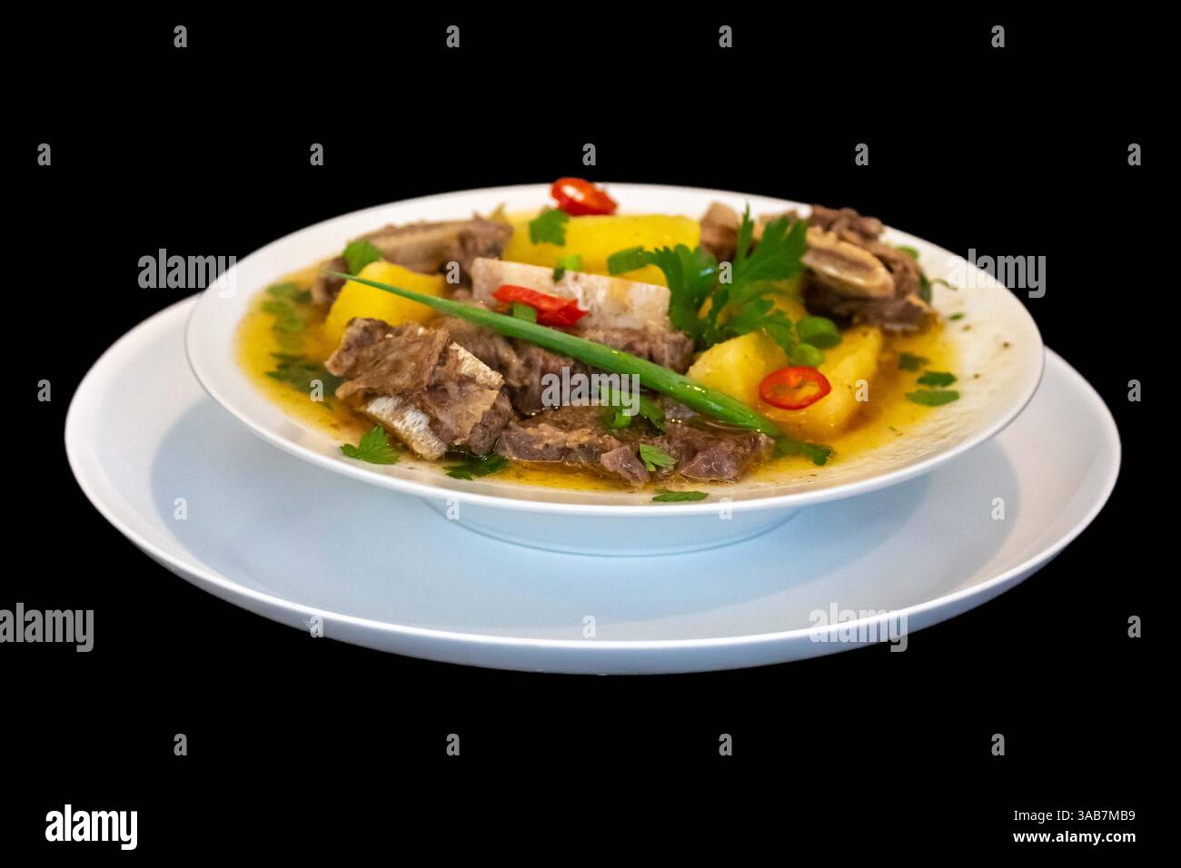 Traditional rustic Brazilian soup known as vaca atolada, prepared with ...