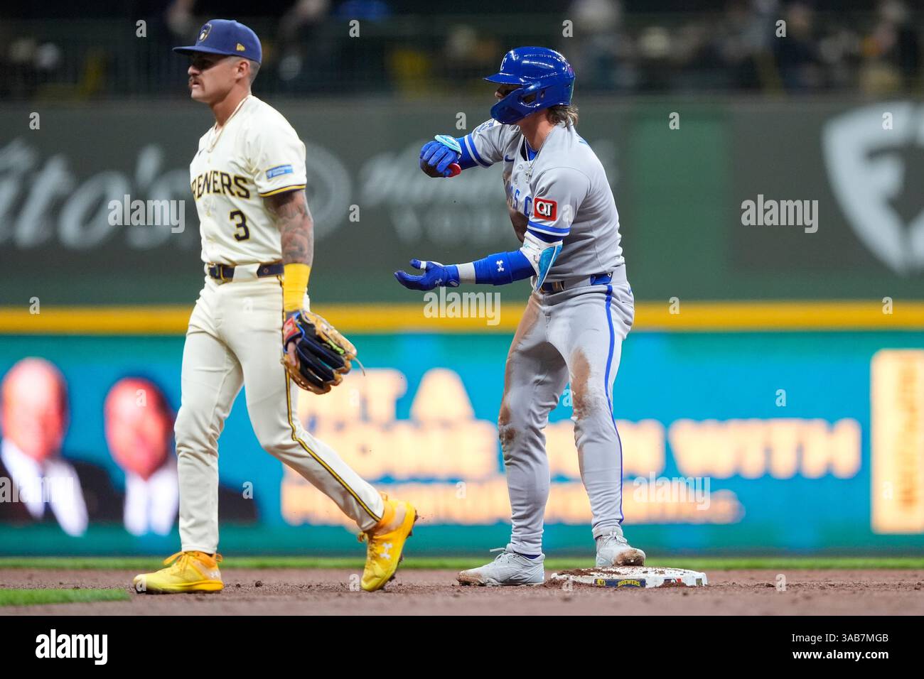 Kansas City Royals' Bobby Witt Jr., right, gestures in front of ...