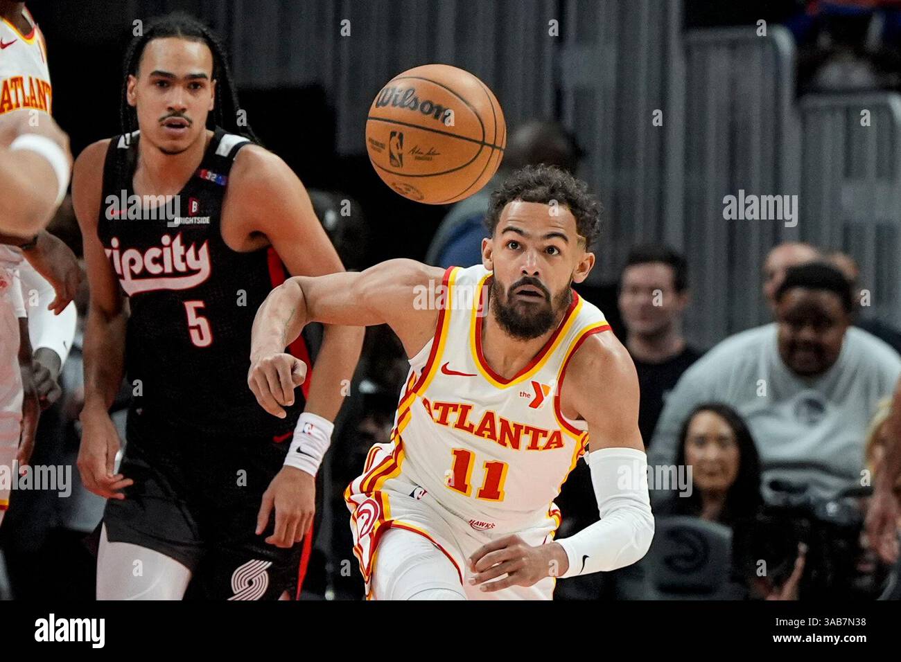 Atlanta Hawks guard Trae Young (11) chases a loose ball against the ...