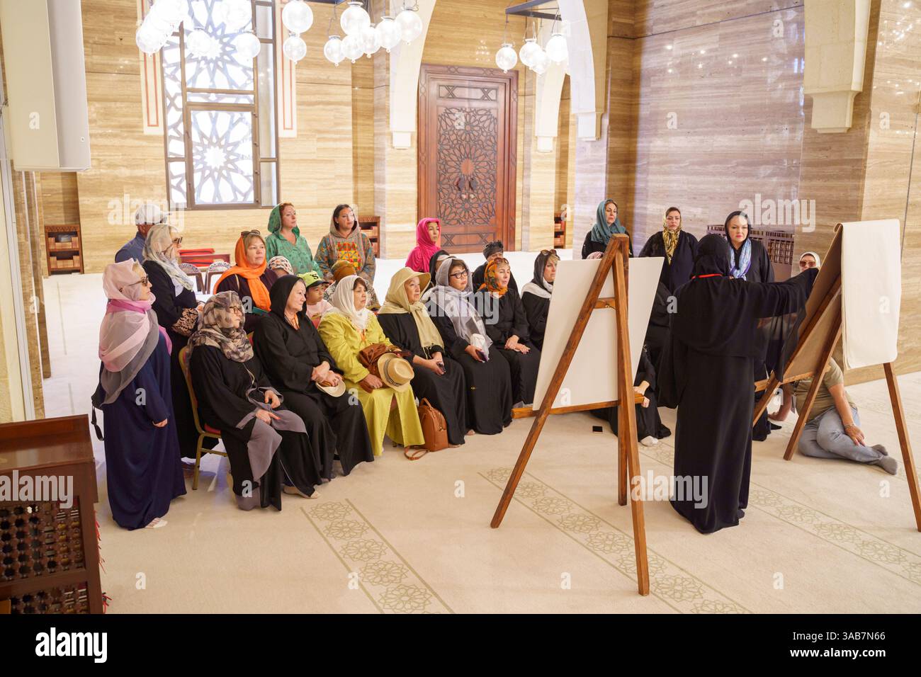 Manama, Bahrain - Jan 15 2024, An Arab woman dressed in a black burqa ...