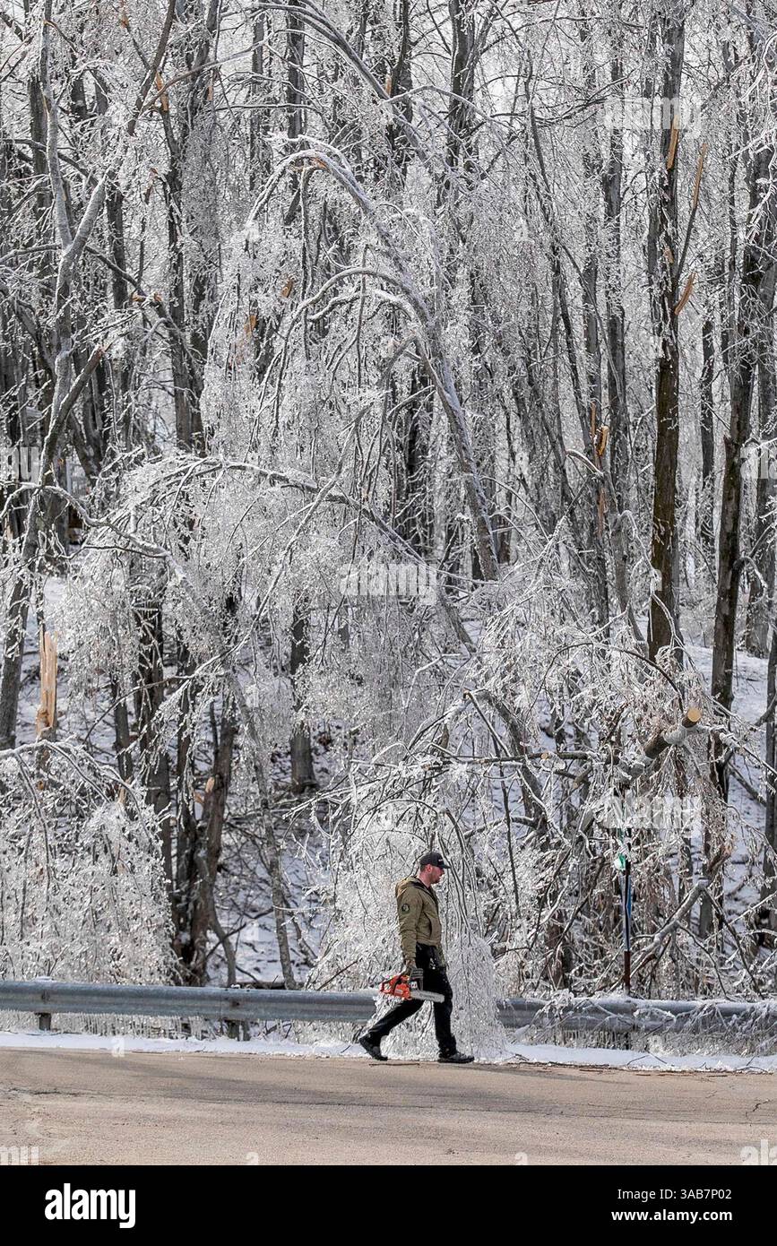 Sgt. Mitch Wallin of the Emmet County Sheriff's Department walks past ...
