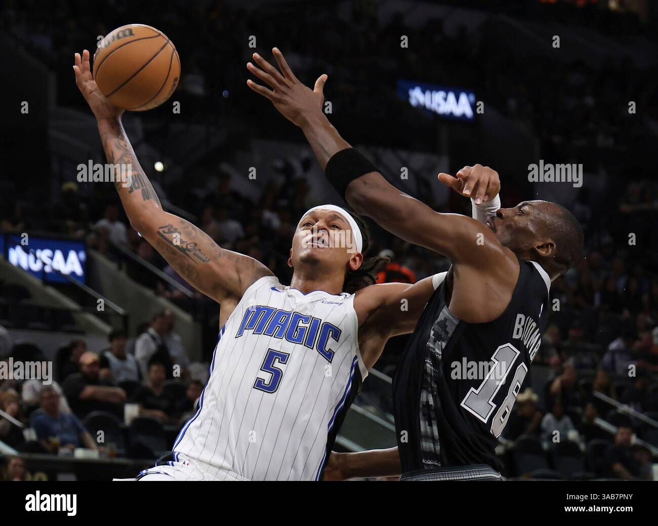 Orlando Magic forward Paolo Banchero (5) takes a contested shot against ...