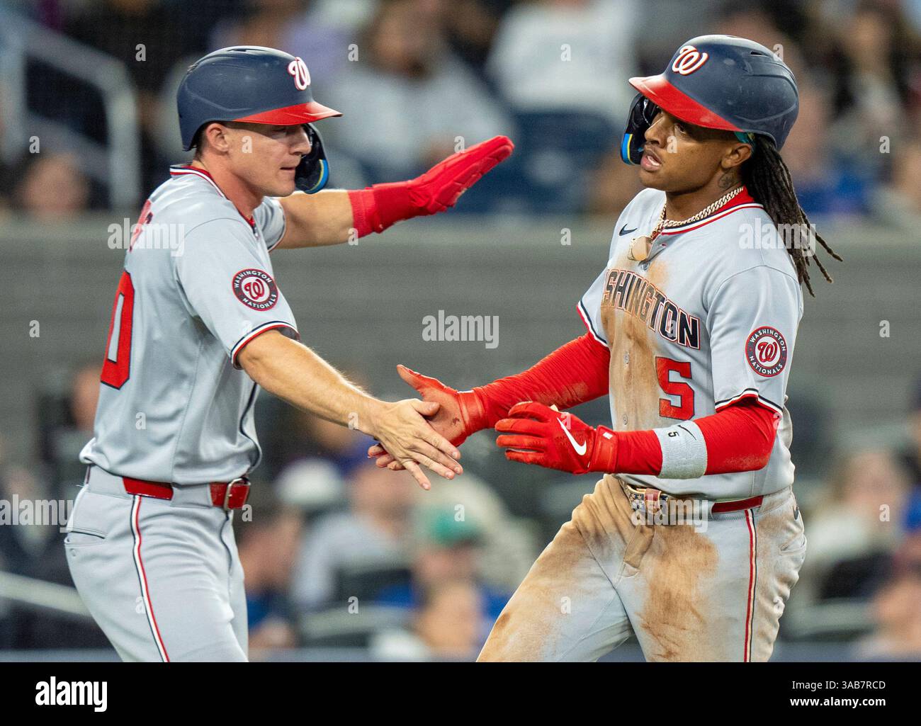Washington Nationals' CJ Abrams (5) and Jacob Young (30) celebrate ...