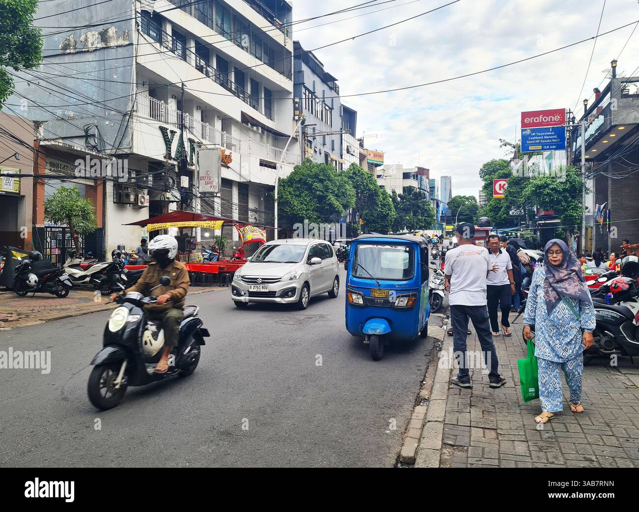 Bajaj or tuk-tuk inexpensive three-wheeler transportation in Jakarta ...
