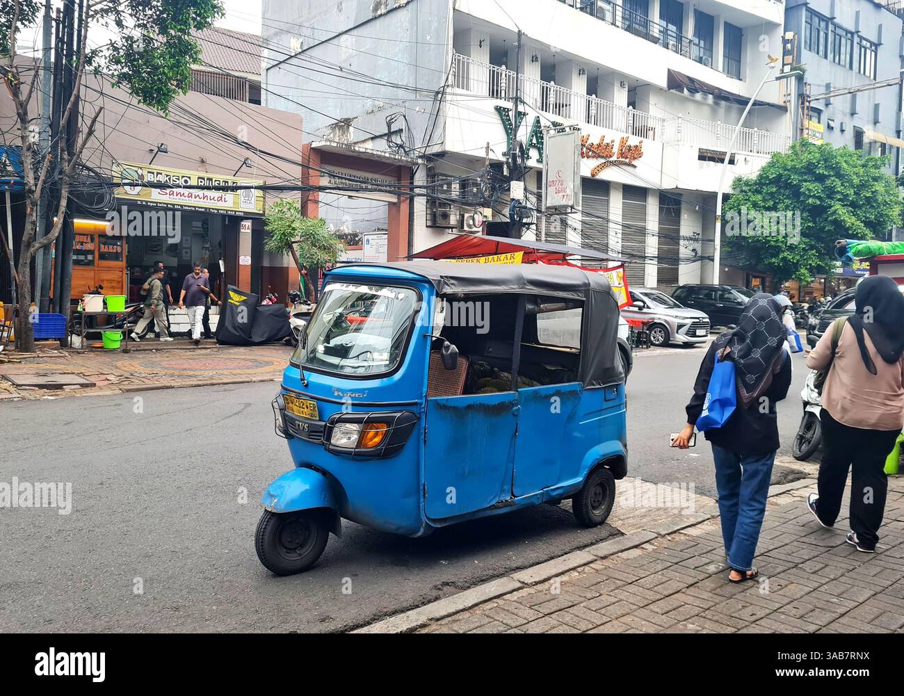 Bajaj or tuk-tuk inexpensive three-wheeler transportation in Jakarta ...