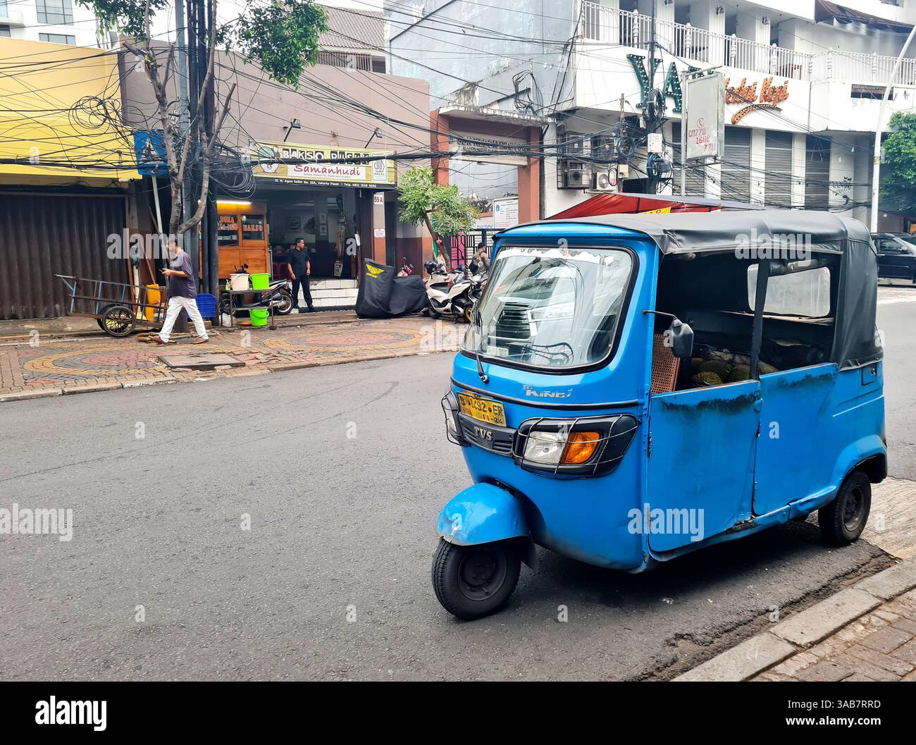 Bajaj or tuk-tuk inexpensive three-wheeler transportation in Jakarta ...