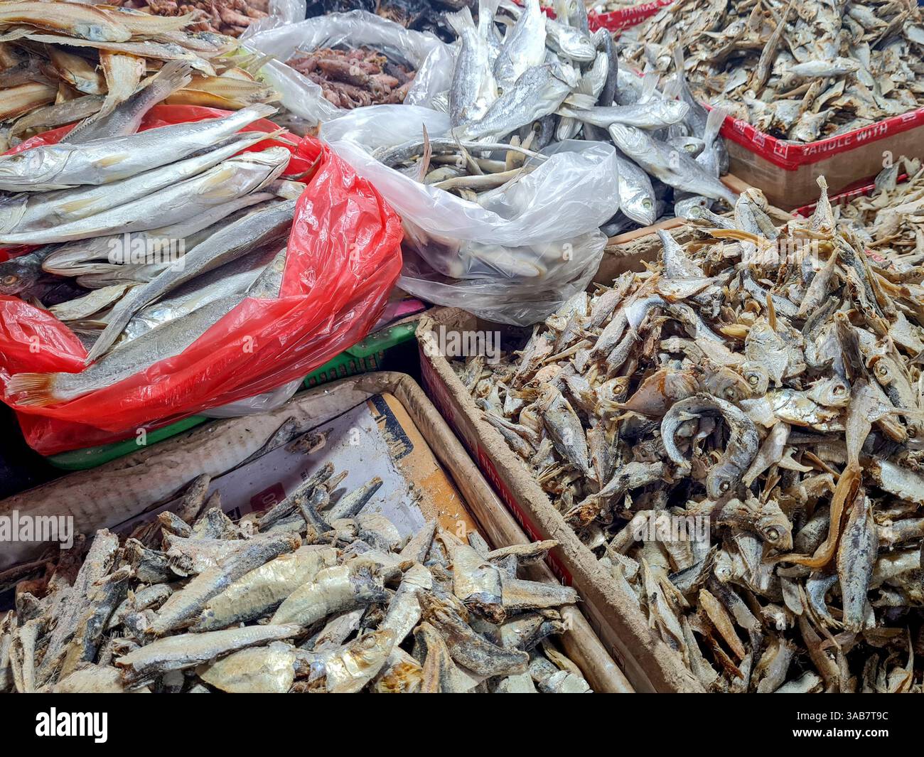 Piles of dried and salted fish for sale in a traditional market in ...