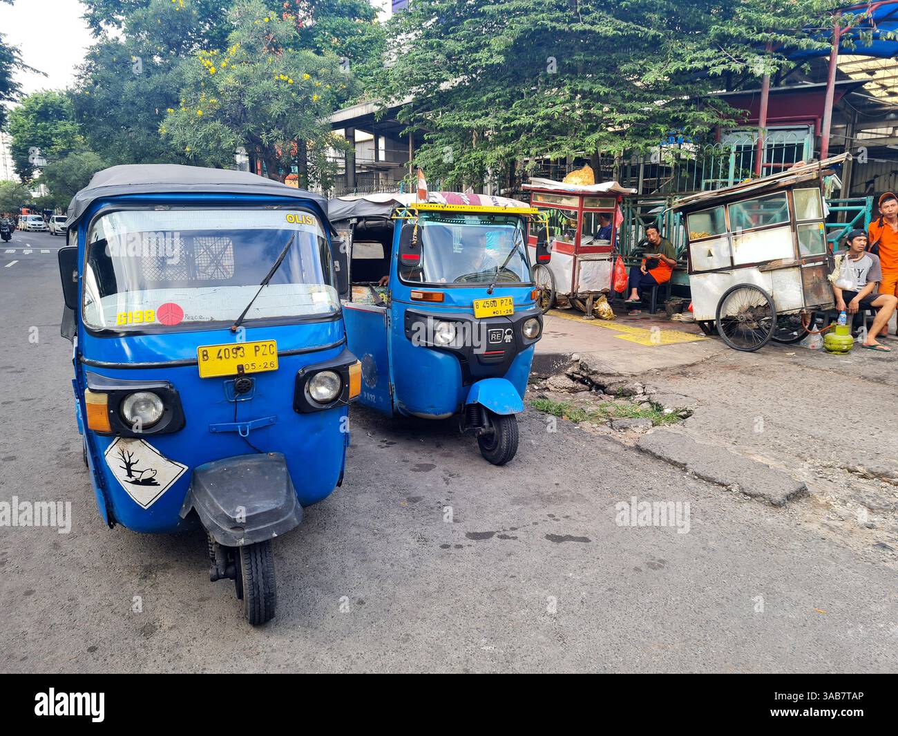 Bajaj or tuk-tuk inexpensive three-wheeler transportation in Jakarta ...