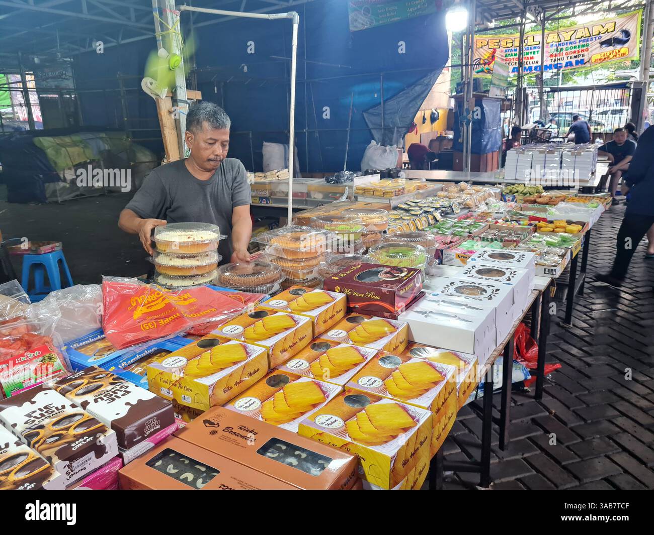 A street food market stall selling all kinds of traditional Indonesian ...