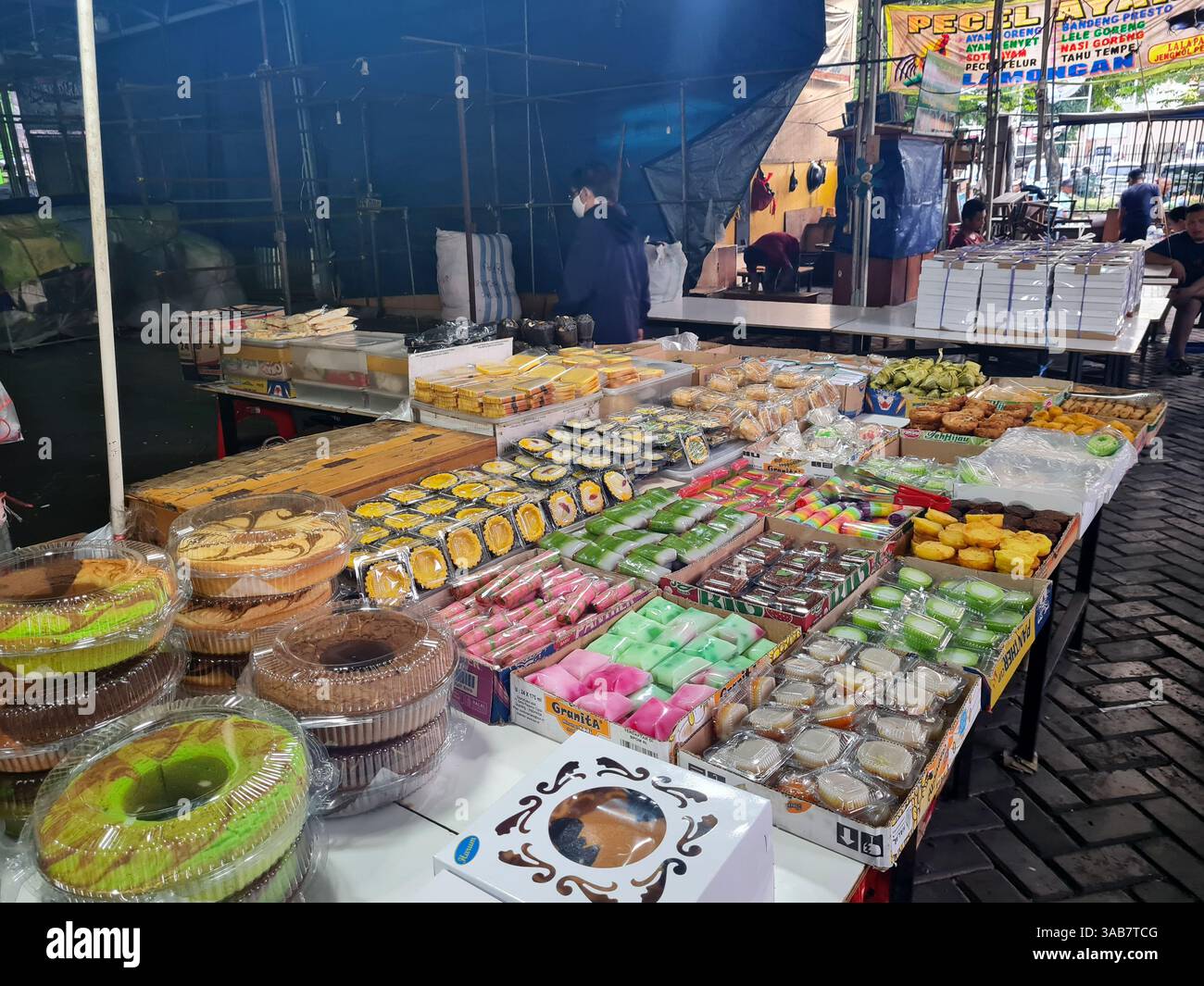 A street food market stall selling all kinds of traditional Indonesian ...