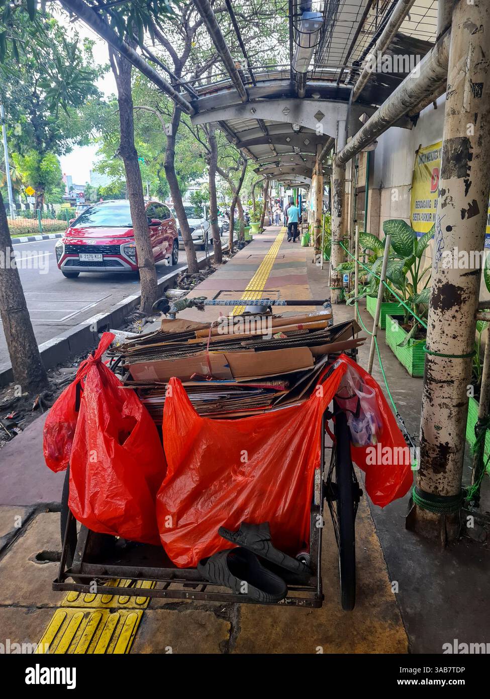 Scene outside Senen Market in Jakarta, Indonesia with covered sidewalk ...