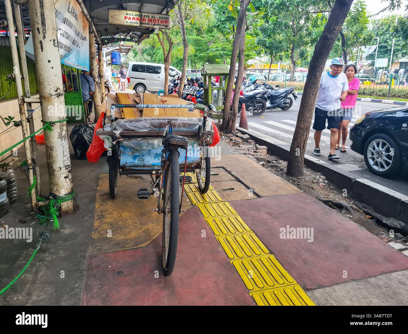 Scene outside Senen Market in Jakarta, Indonesia with covered sidewalk ...