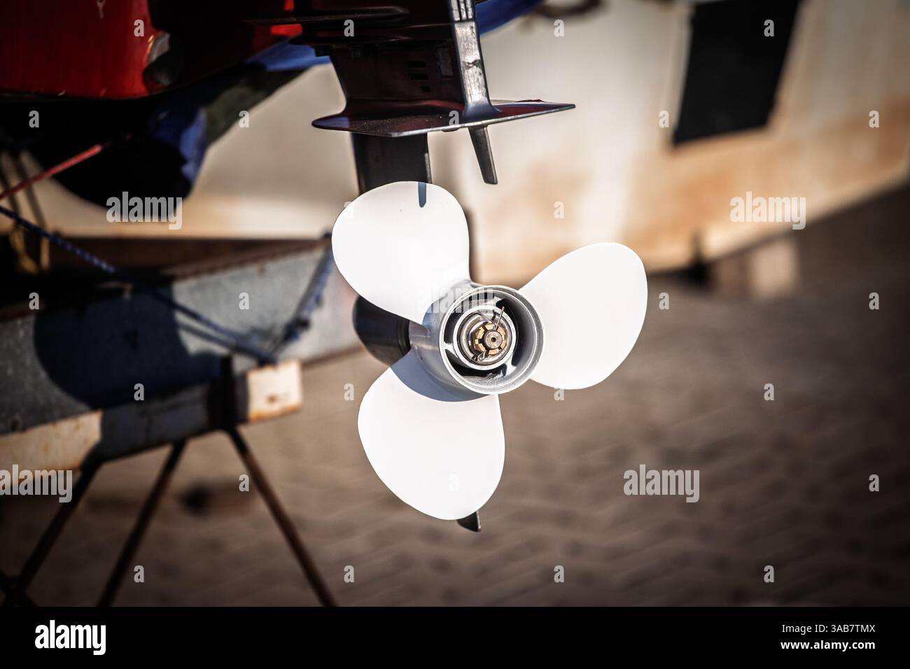Selective blur of a marine propeller (helix) in motion captures the ...