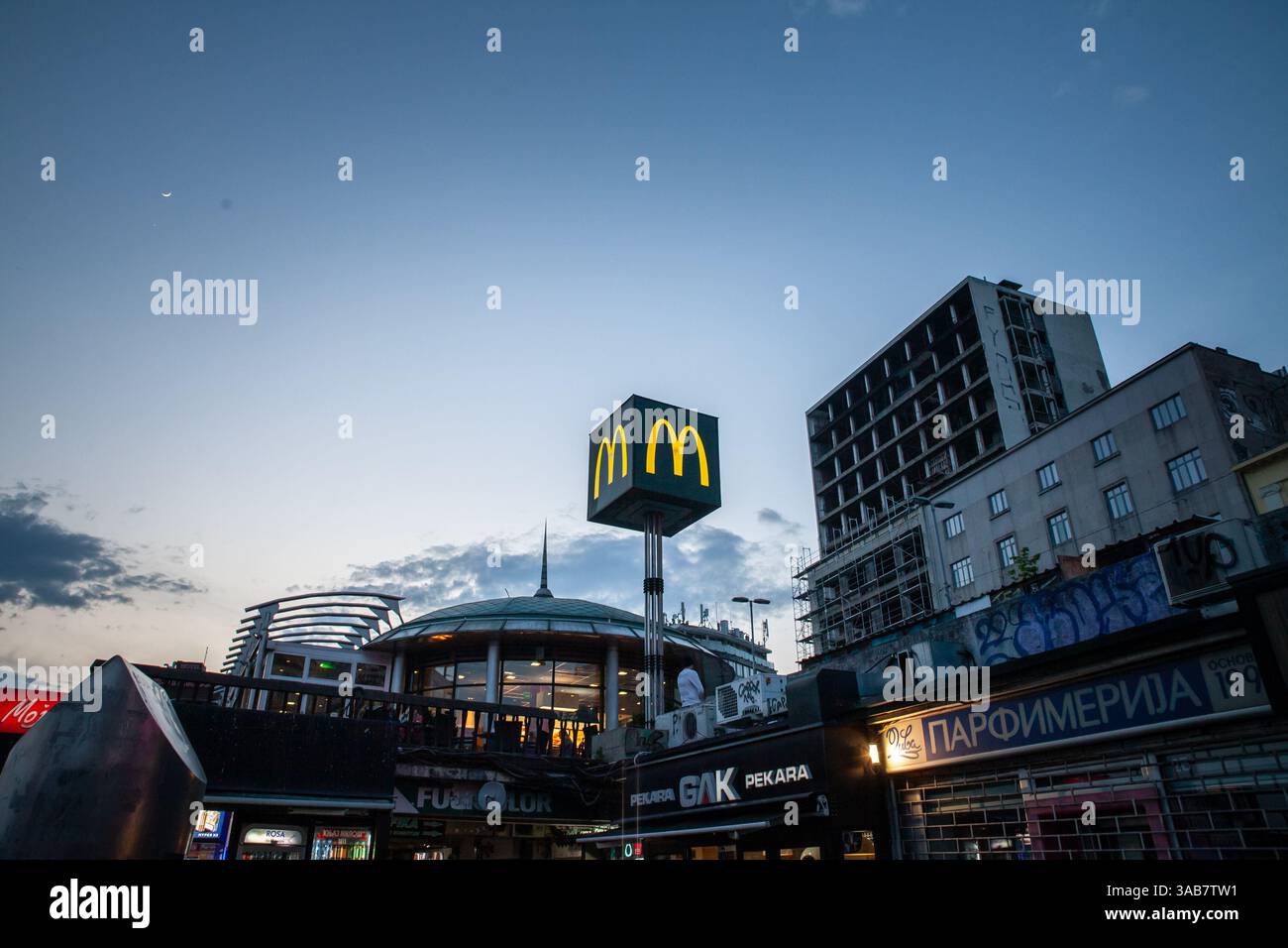 VALENCIA, SPAIN - OCTOBER 13, 2024: Illuminated McDonald's logo at dusk ...