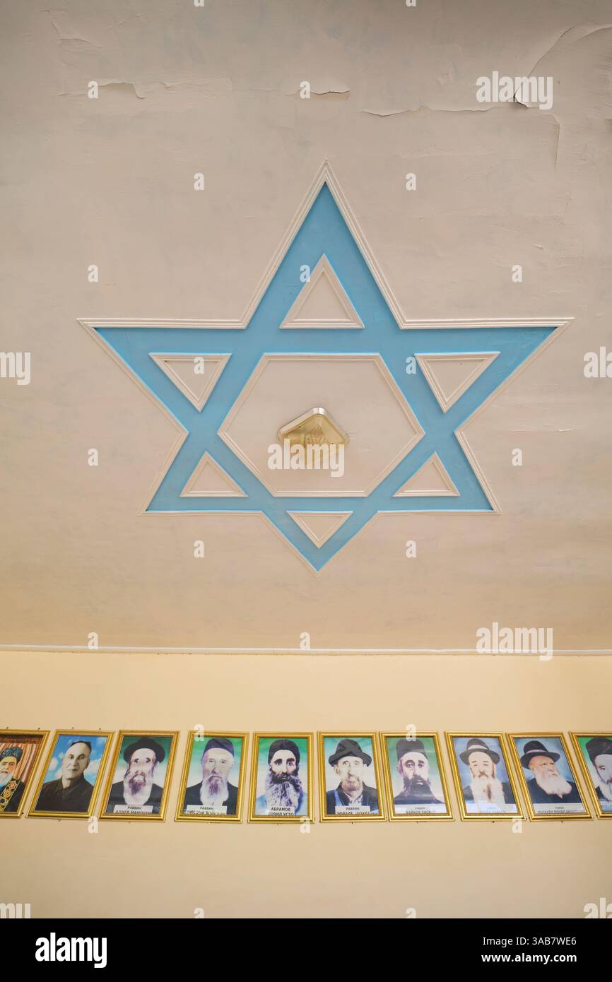 Many important rabbi, leader photographs hang on a wall near the main ...