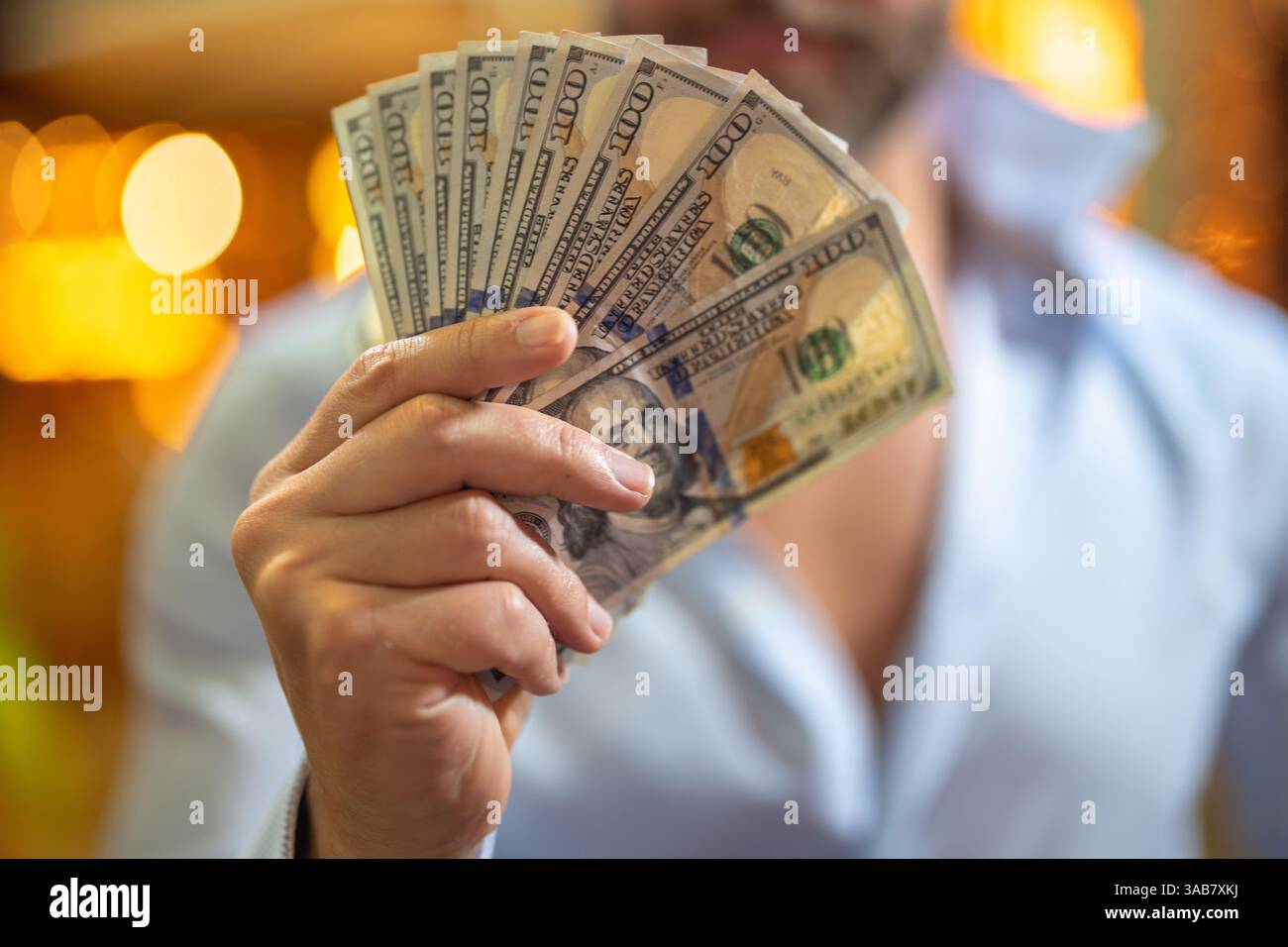 Rich businessman holding cash. Successful rich man counting dollar ...