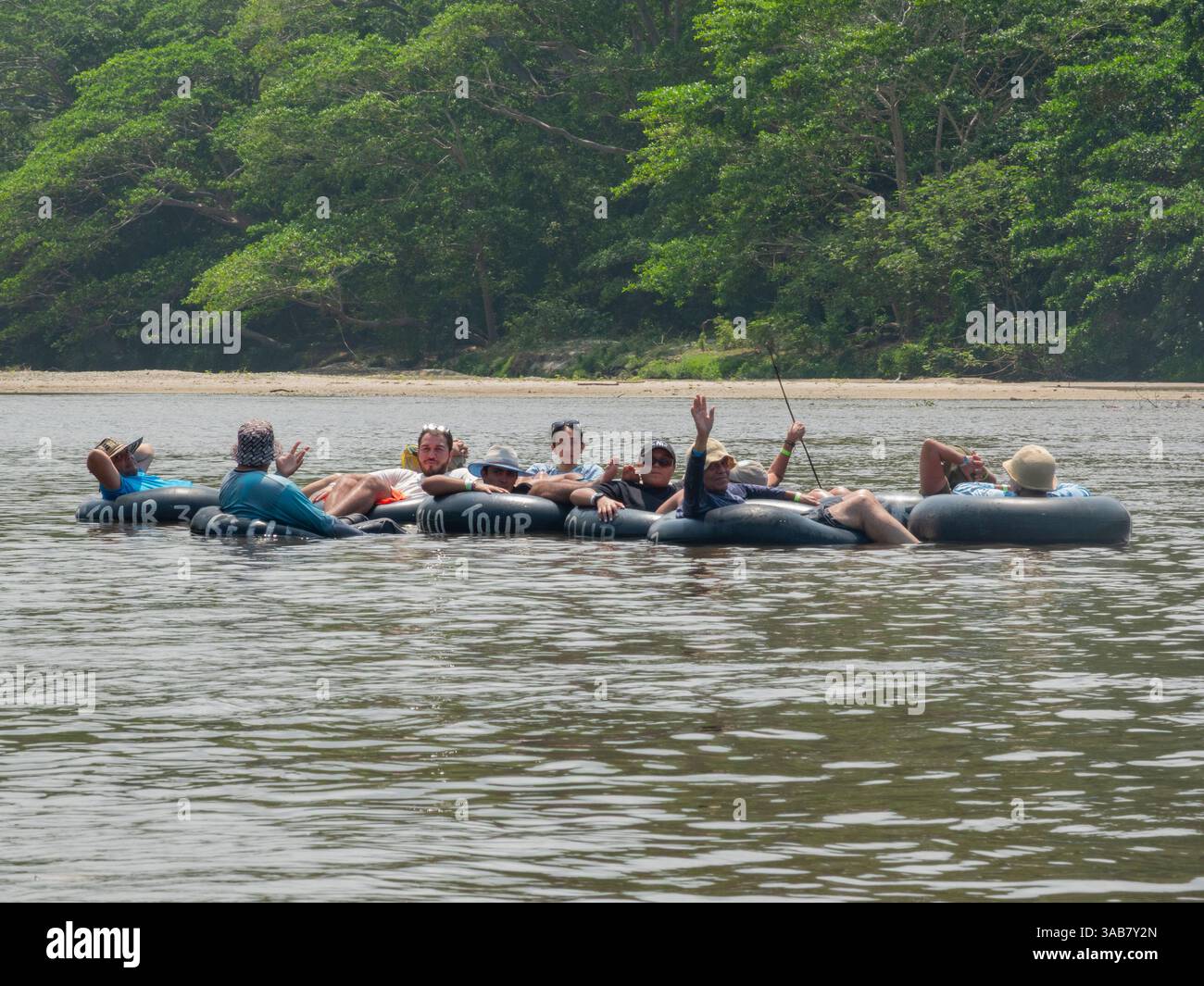 Tourists tubing down the Rio Don Diego, Sierra Nevada de Santa Marta ...