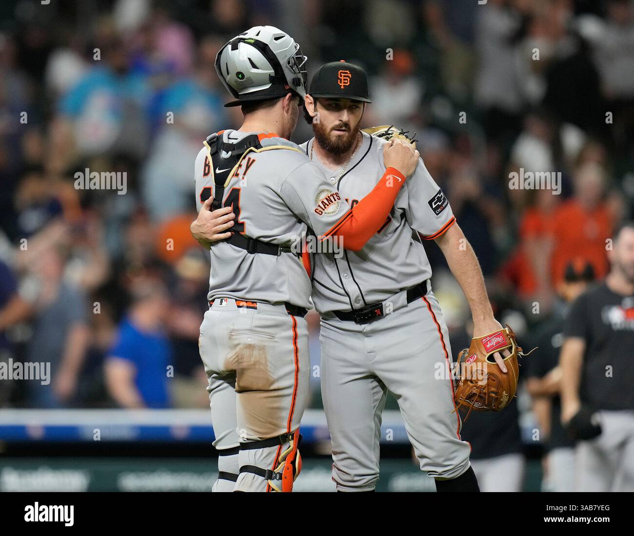 San Francisco Giants relief pitcher Ryan Walker (74) hugs catcher ...