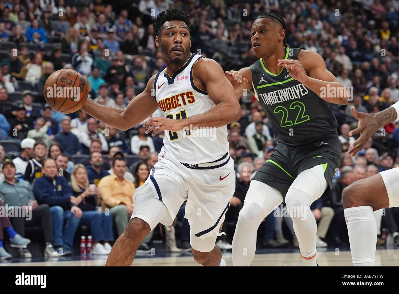 Denver Nuggets guard Jalen Pickett, left, passes the ball as Minnesota ...