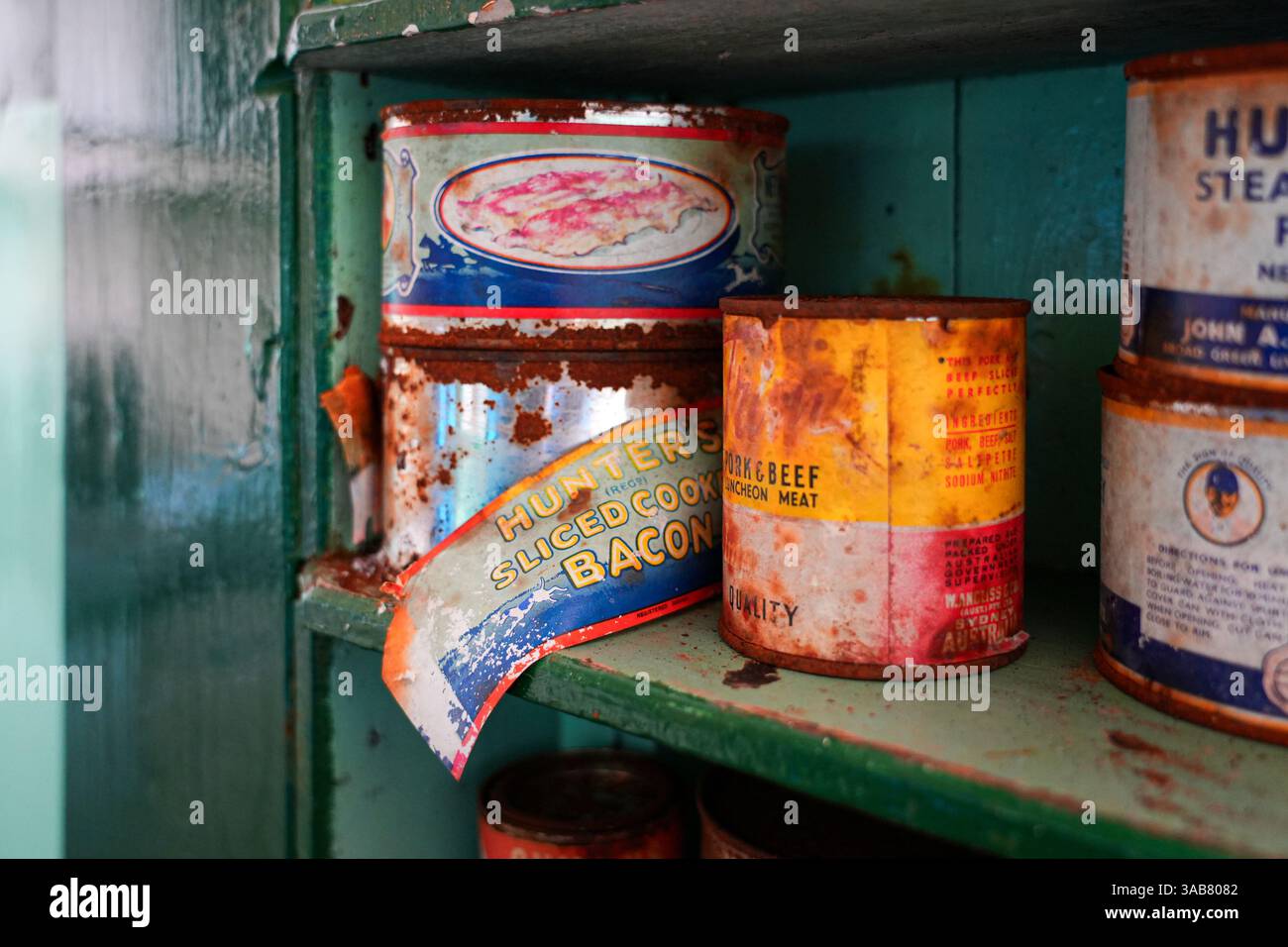 Old rusty cans of luncheon meat in the Bransfield House in Port Lockroy ...