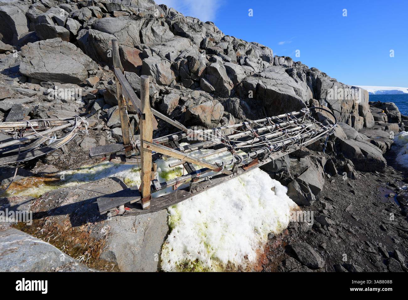 Old wooden sled lying on the rocks of Goudier Island in Port Lockroy, a ...