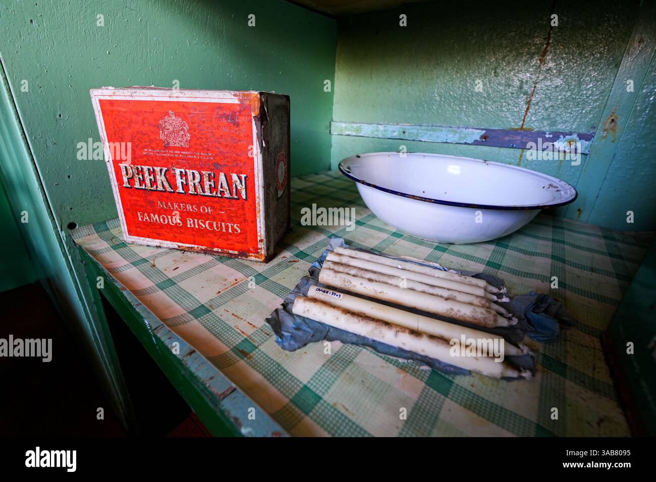 Old box of biscuits and candlesticks in the Bransfield House in Port ...