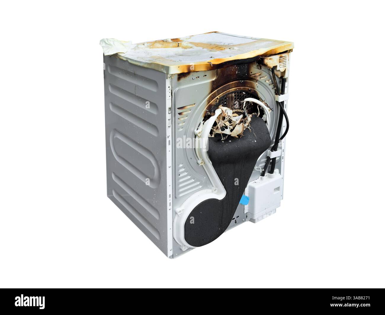 A burnt washing machine isolated on white background. Burned and ...