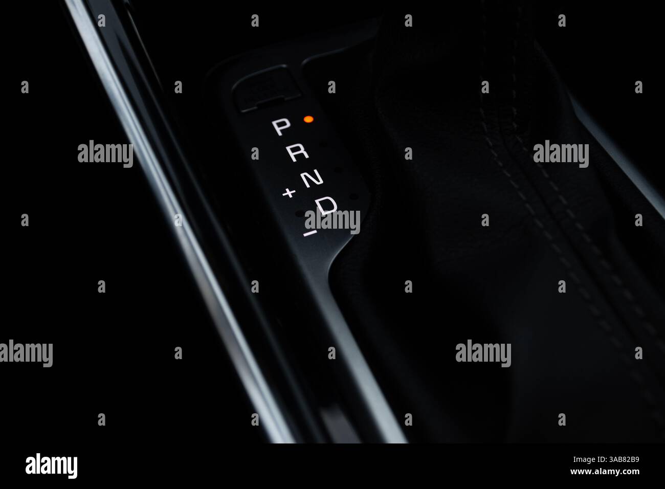Automatic transmission shift selector in the modern car black leather ...