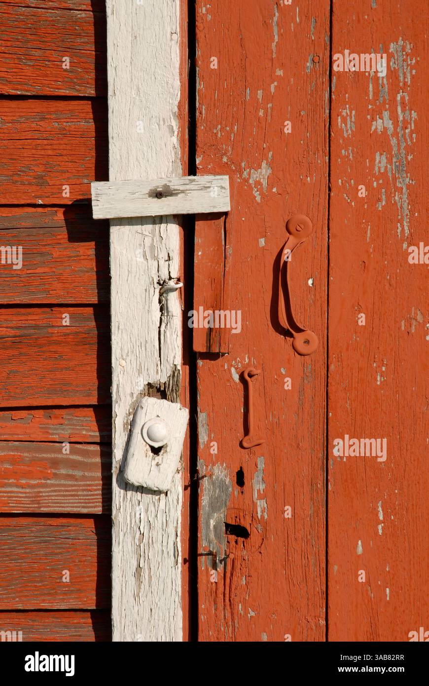 Numerous old locks, stops, a handle and something missing shows the ...