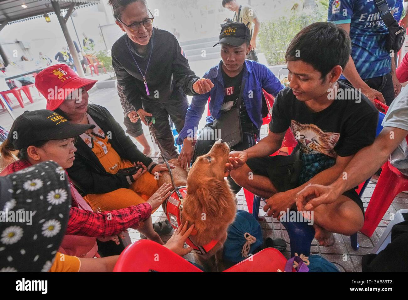 K9 named Lek, center, works as an emotional support with relatives of ...