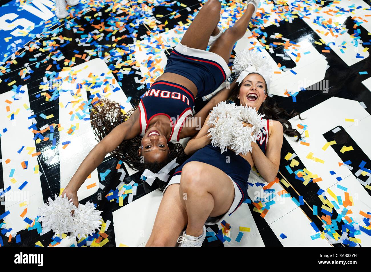 UConn Huskies cheerleaders celebrate a UConn Huskies victory after the ...