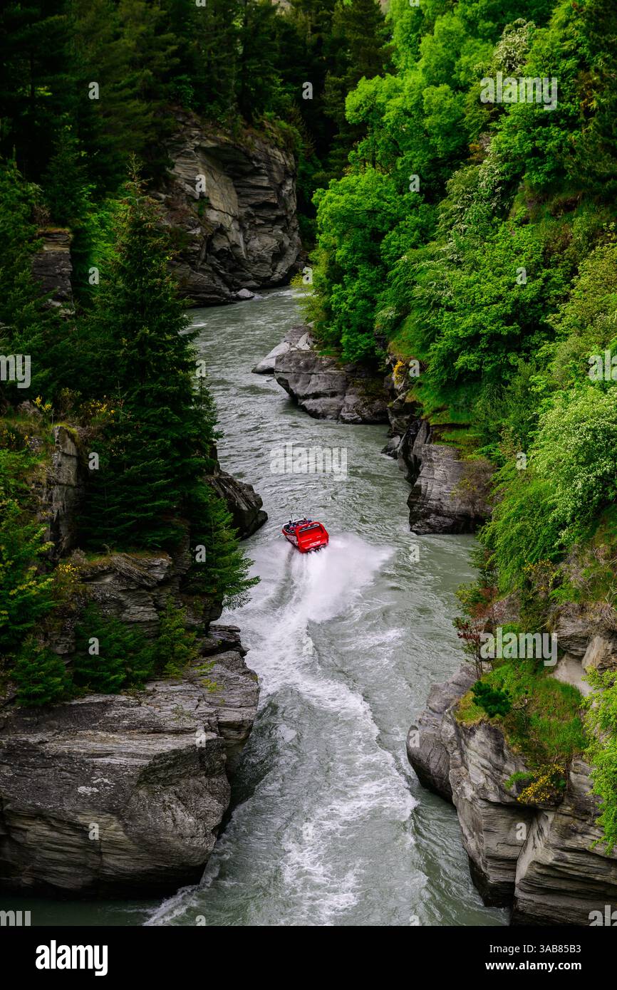 The Shotover River in New Zealand with Jet boats jetting by Stock Photo ...