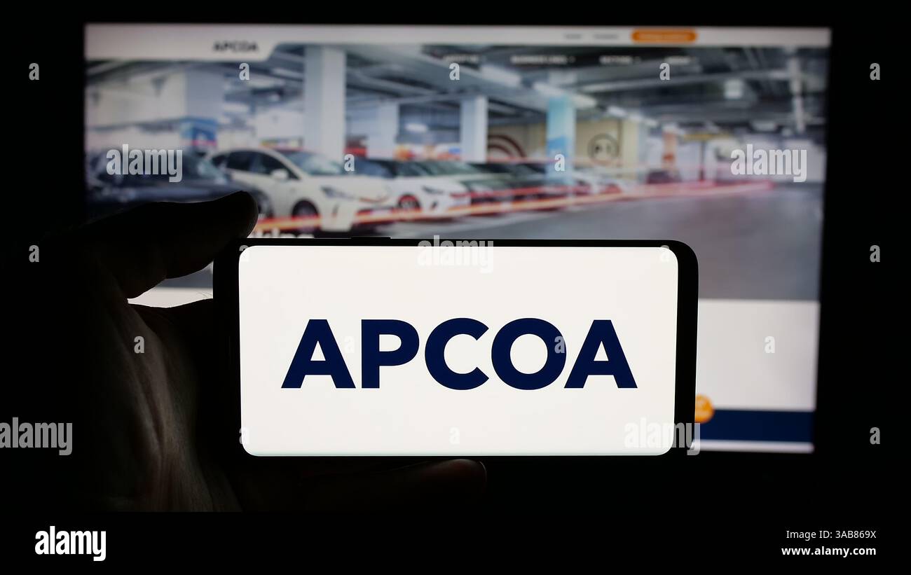 In this photo illustration, a person is holding a cellphone with the ...