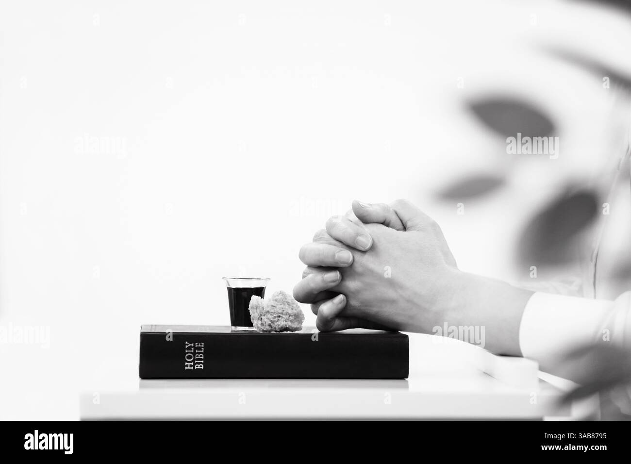 Communion and praying Christians, bread and wine and bible, Holy Week ...