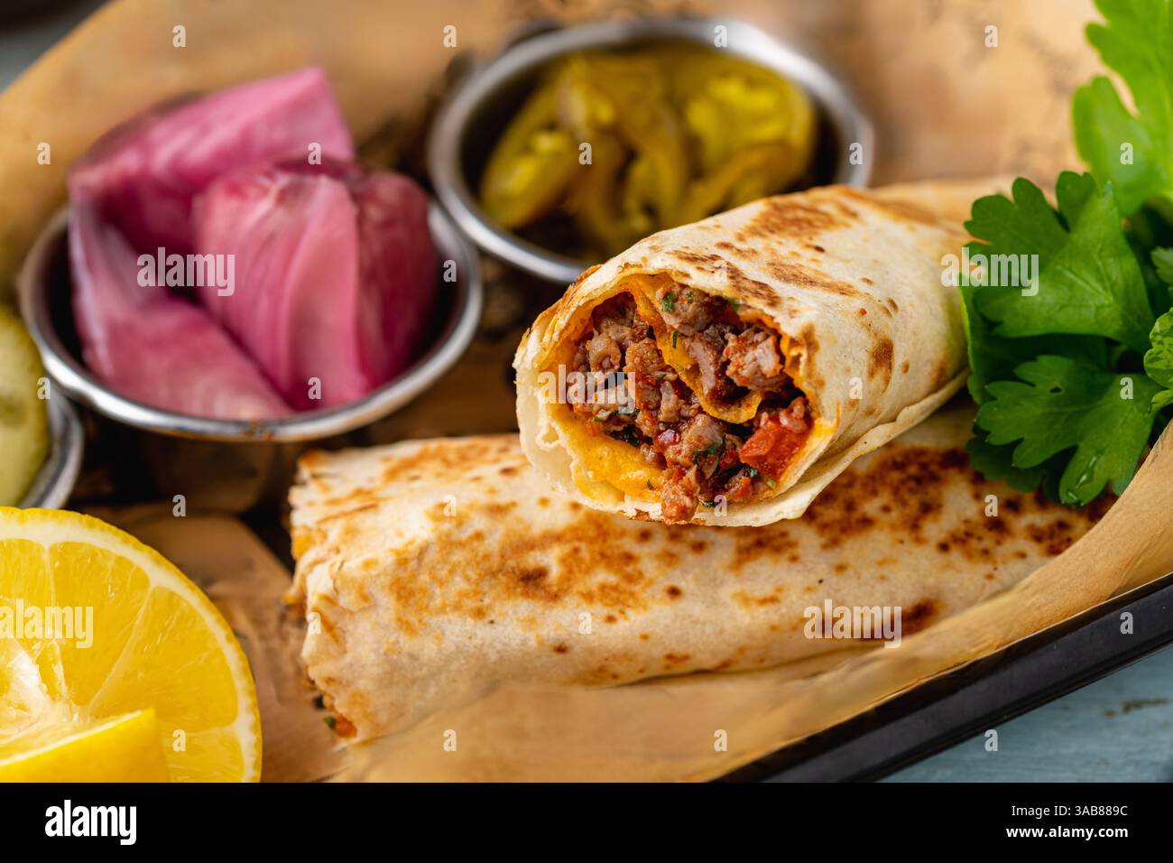 Turkish kebab tantuni served with sauce and pickles. Mersin tantuni ...