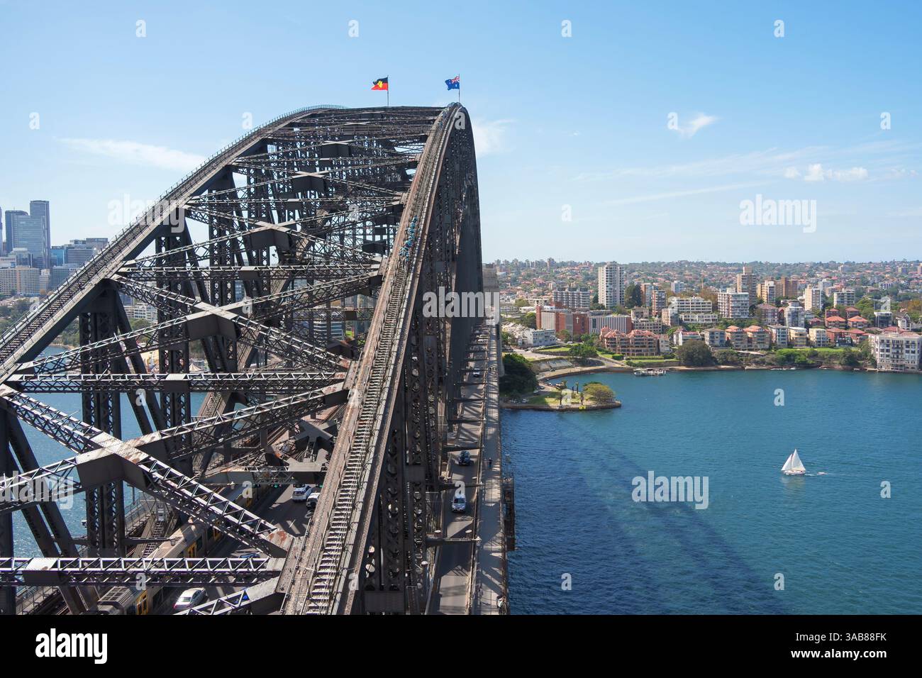 Sydney, Australia - March 2025 - A small sail boat approaches the ...