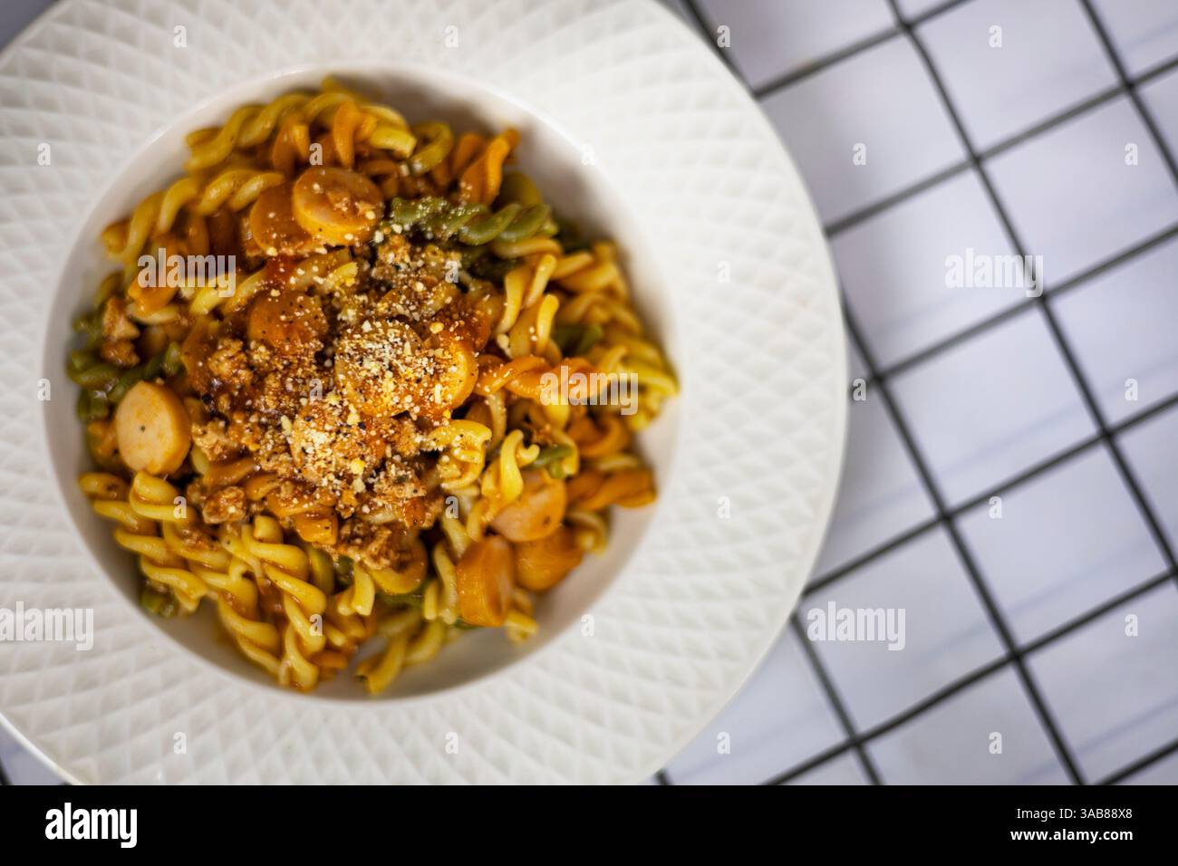 Pasta Fusilli Tricolore With Tomatoes Sauce And Sausage. Background for ...